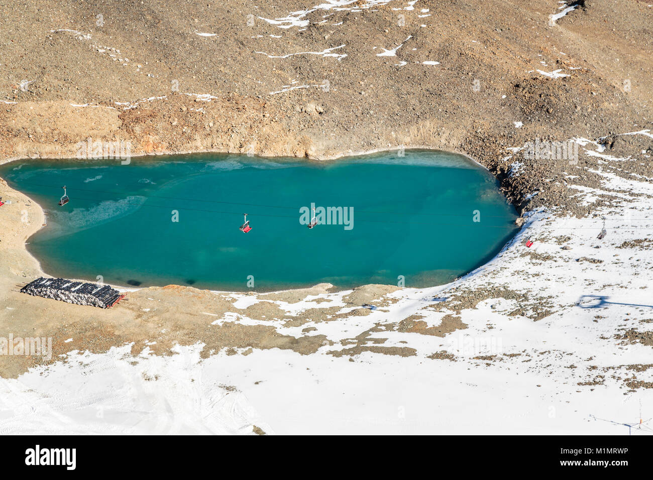 A small alpine lake in the Bernina mountain peaks and the Diavolezza ...
