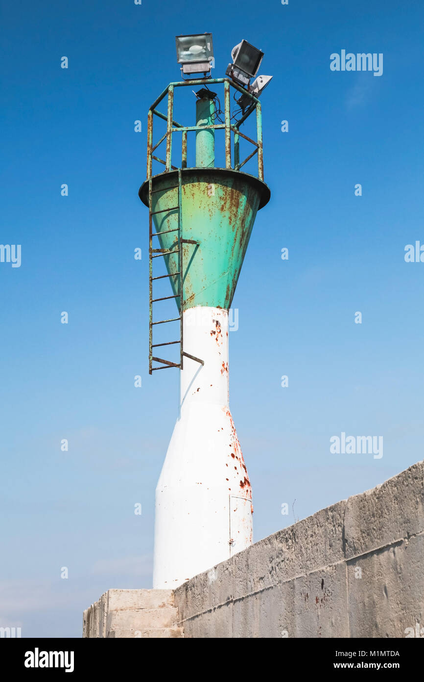 Green and white lighthouse tower under blue sky. Port of Burgas, Black ...