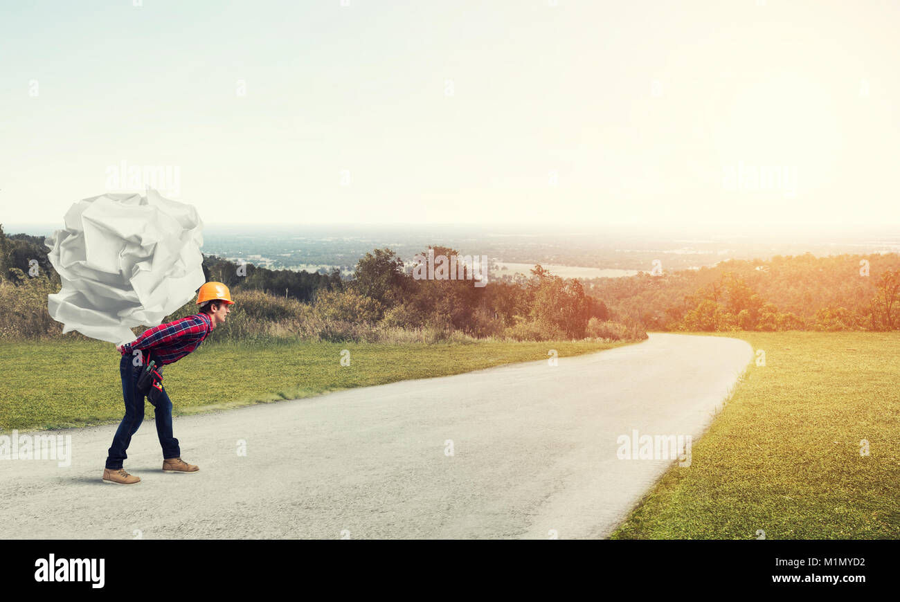 Engineer man carry load Stock Photo - Alamy