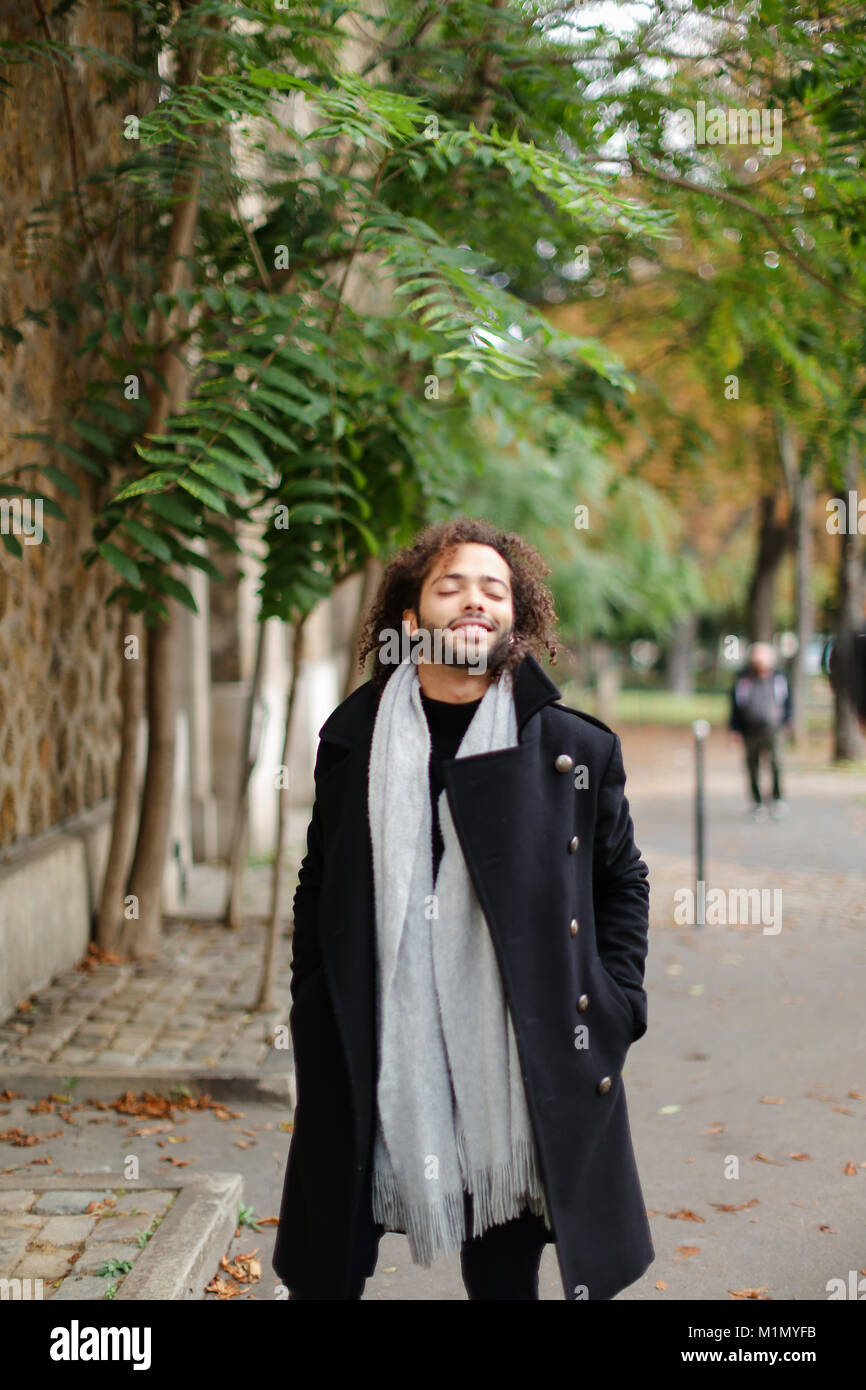 Jocund guy shaking head with fleecy hair and laughing Stock Photo - Alamy