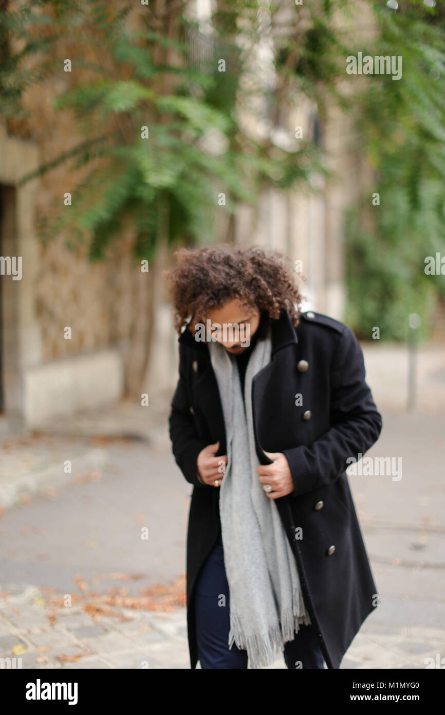 Young mix blood male person walking outside Stock Photo - Alamy