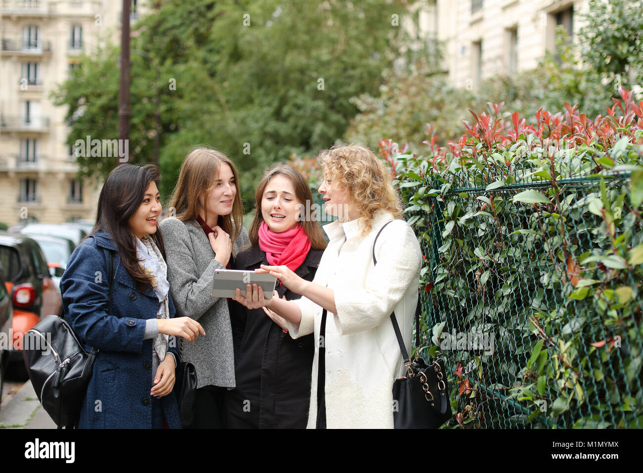 International students talking with teacher outdoors in Stock Photo - Alamy