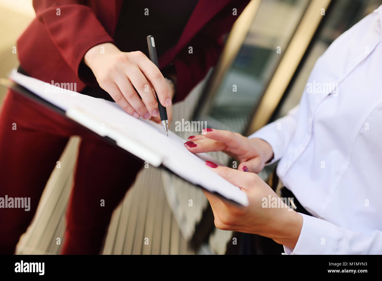 business women sign a contract or documents Stock Photo - Alamy