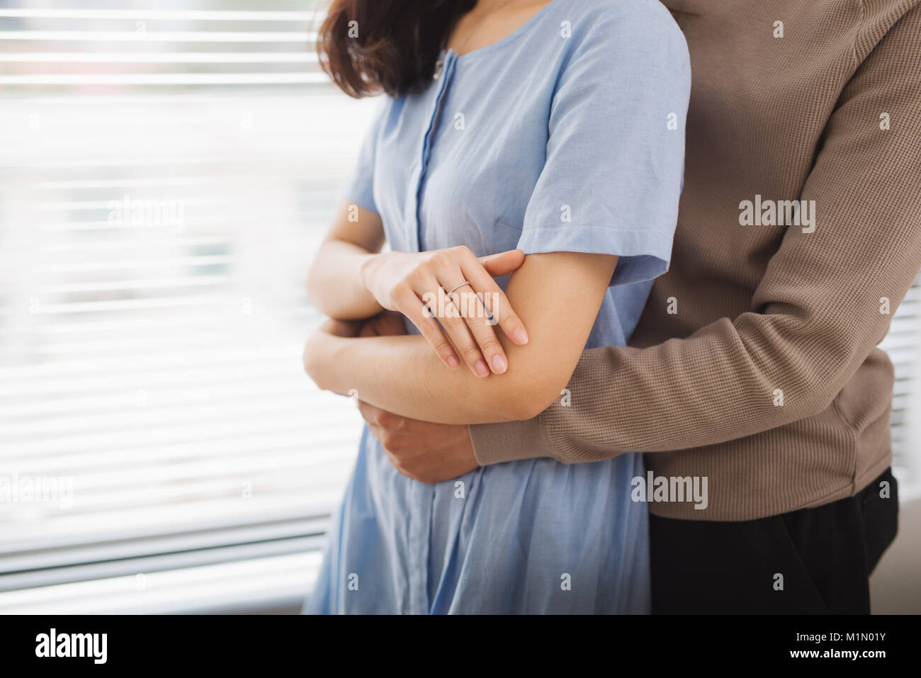Couple in love. Man hugging his wife Stock Photo - Alamy