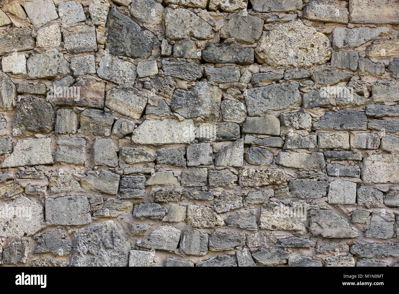 Village coquina stone wall background Stock Photo - Alamy