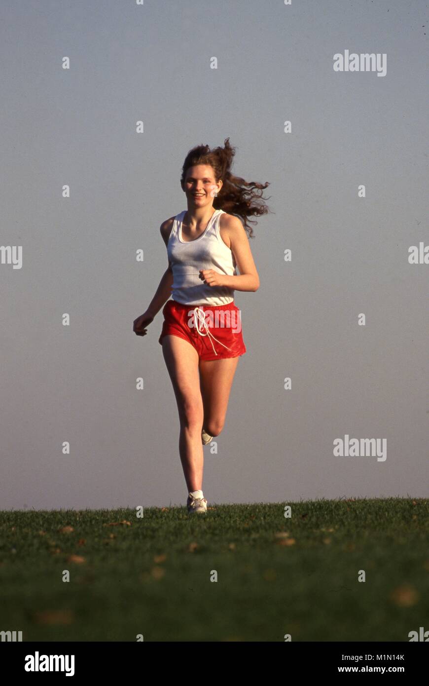Happy girl teenager running clean hi-res stock photography and images ...