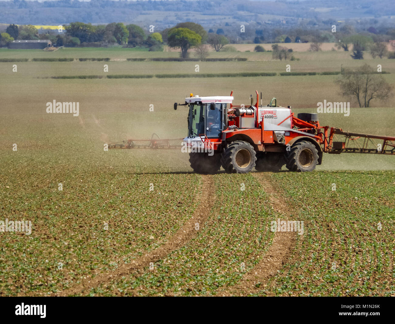 tractor crop spraying a field Stock Photo - Alamy