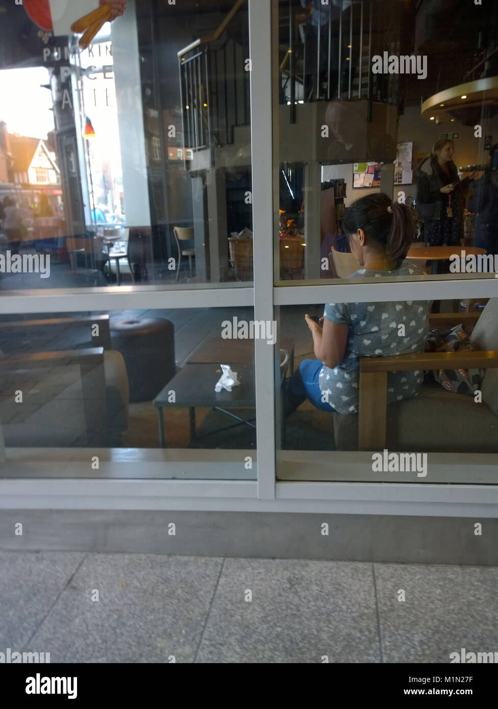 woman using mobile phone smartphone inside a building Stock Photo - Alamy
