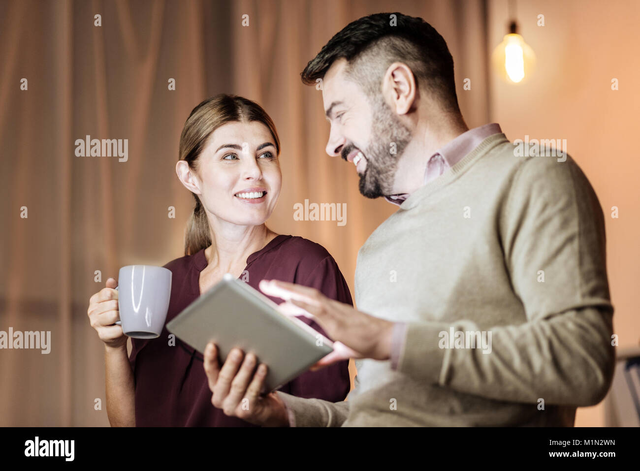 Happy distance workers looking at each other Stock Photo - Alamy