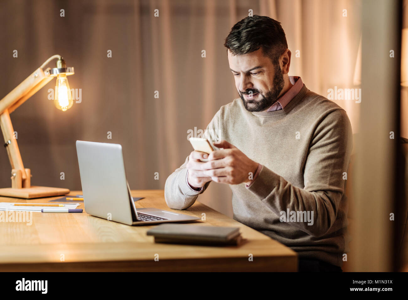 Concentrated male person typing message Stock Photo - Alamy