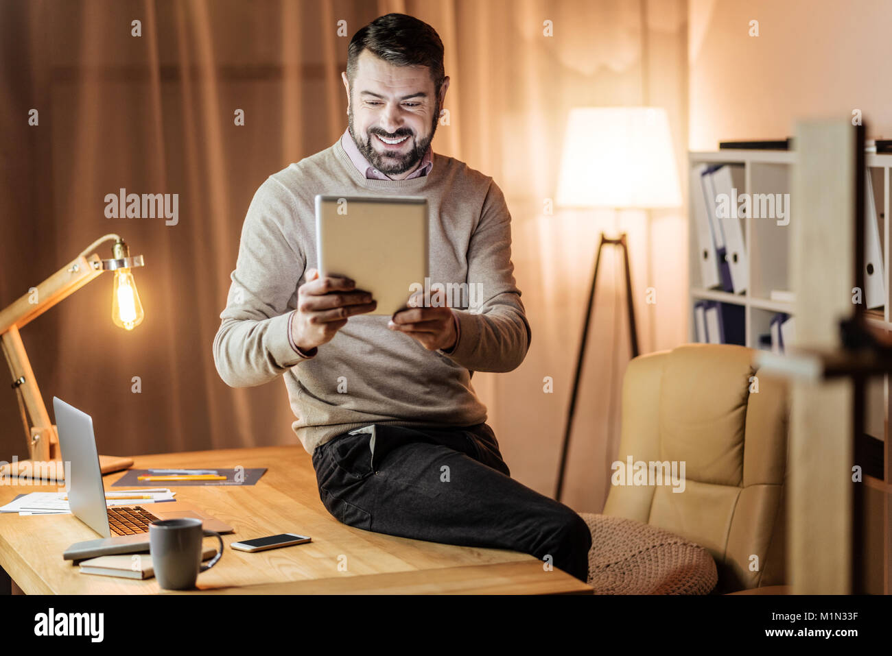 Handsome male person using his gadget Stock Photo - Alamy