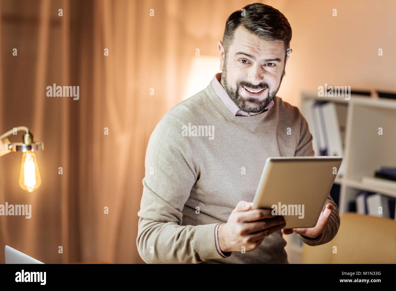 Portrait of delighted man that posing on camera Stock Photo - Alamy