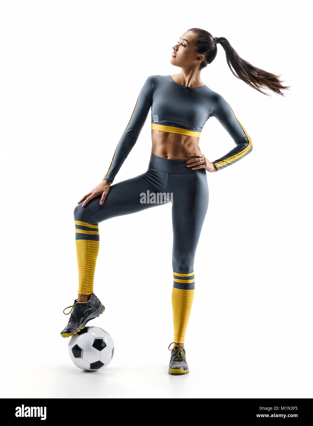 Ready to play. Football player woman standing in silhouette isolated on ...