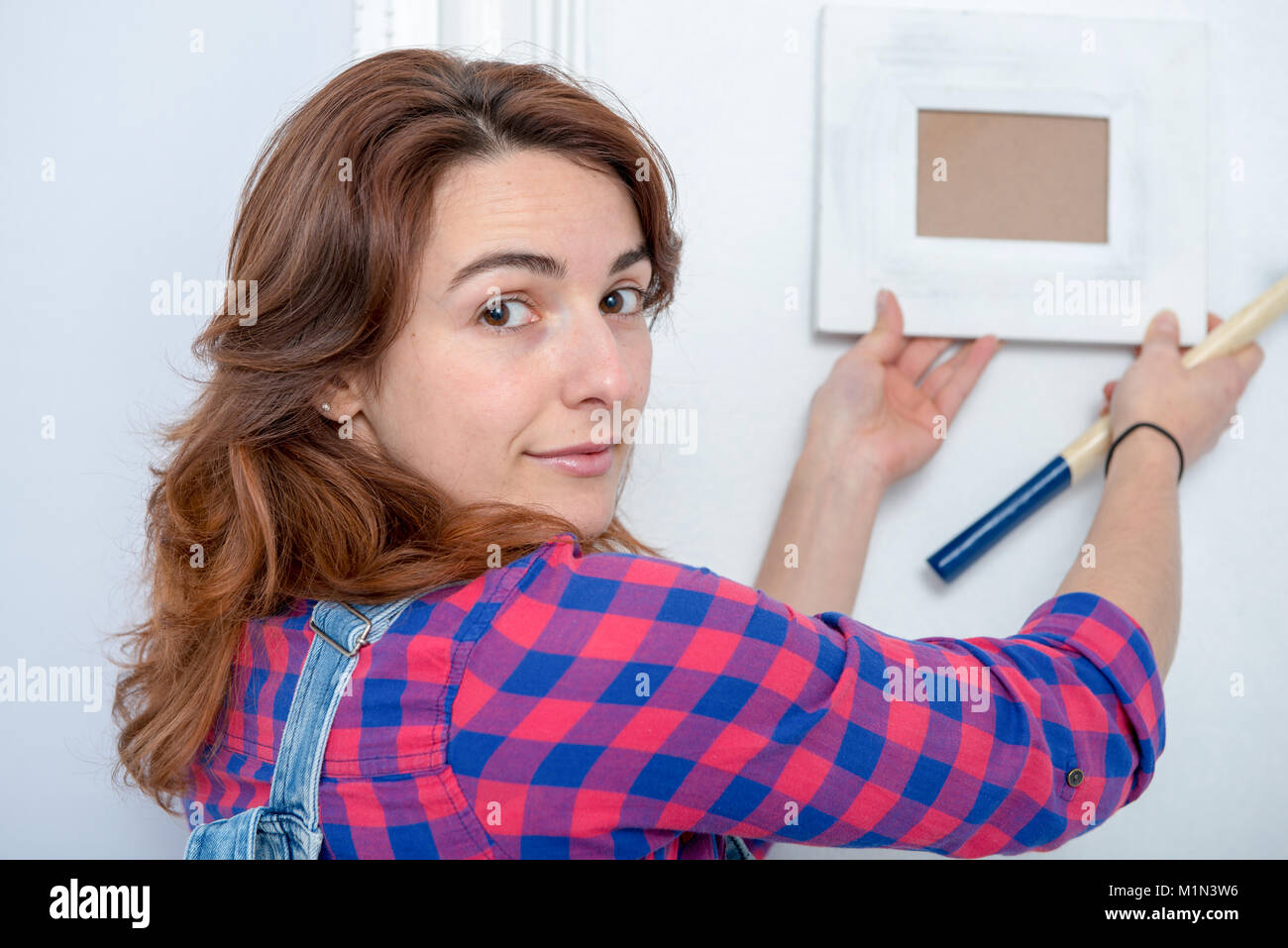 a young woman doing DIY work at home Stock Photo - Alamy