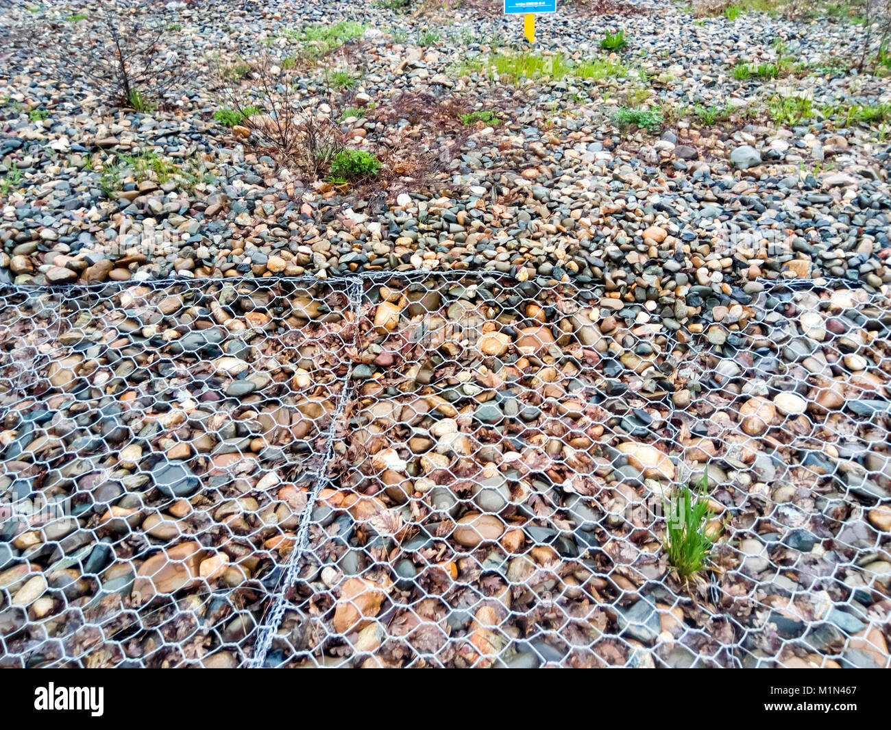 Retaining net on the slope. The net keeps the pebble from scattering ...