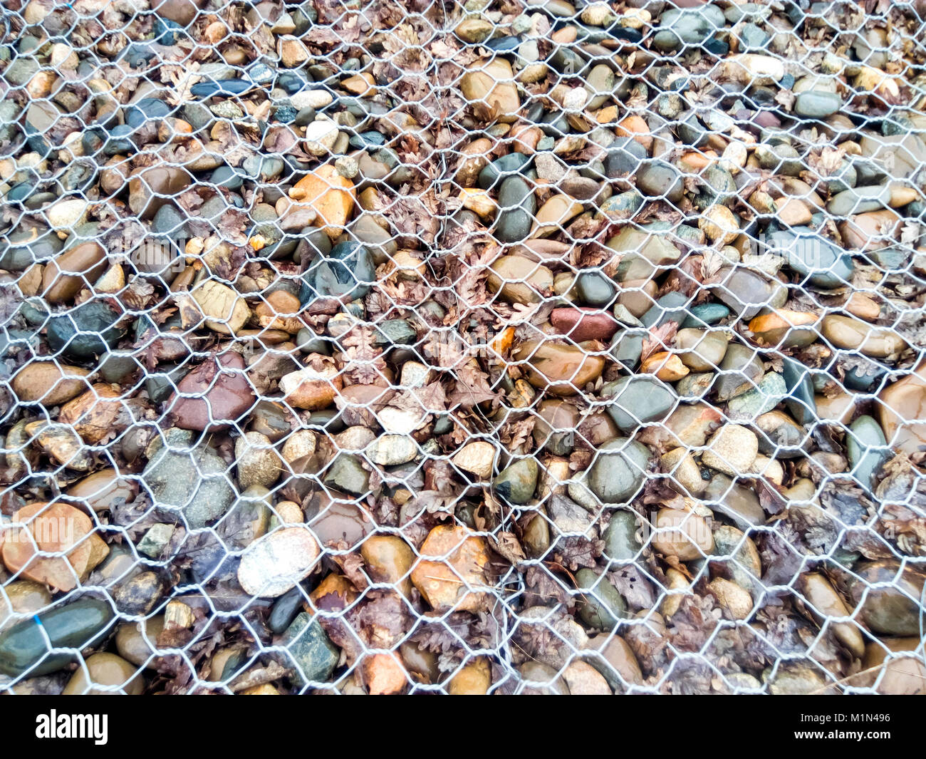 Retaining net on the slope. The net keeps the pebble from scattering ...