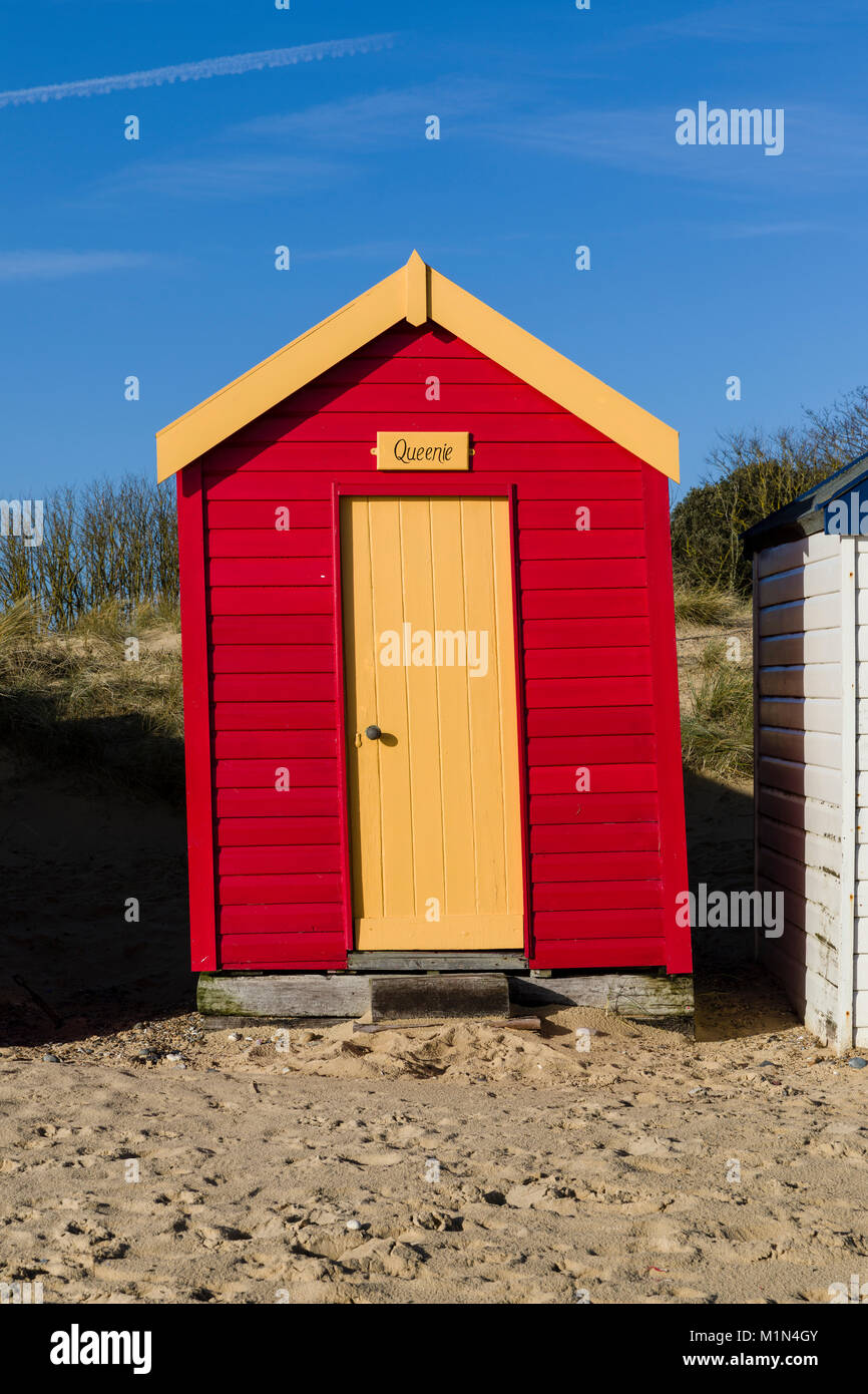 Traditional Wooden Beach Hut with crisp blue sky on Southwold Beach ...