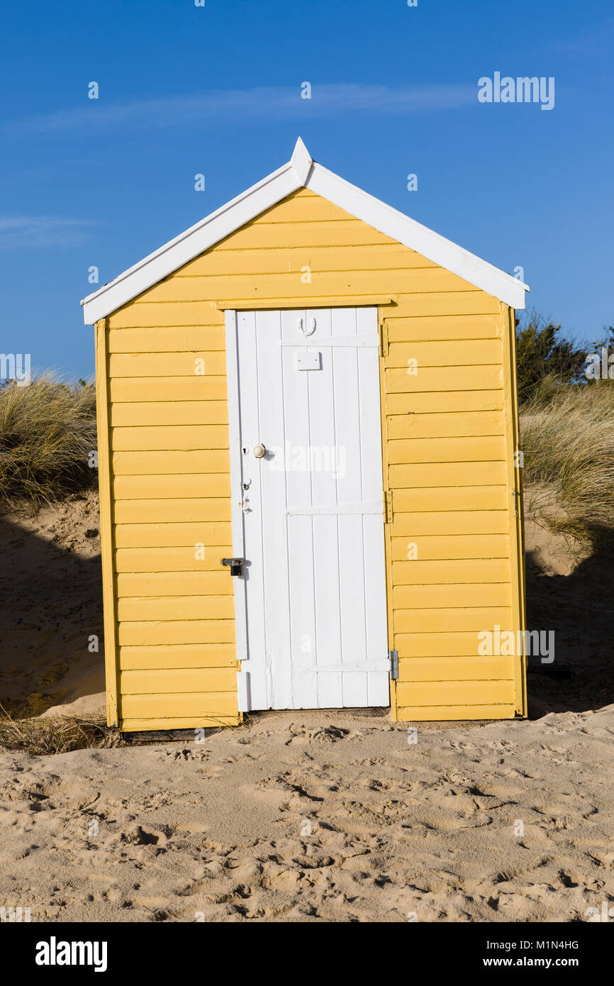 Traditional Wooden Beach Hut with crisp blue sky on Southwold Beach ...