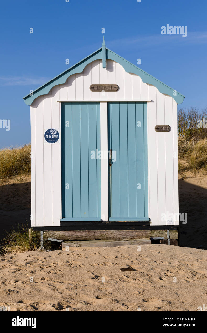 Traditional Wooden Beach Hut with crisp blue sky on Southwold Beach ...