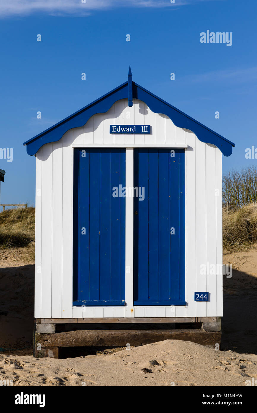 Traditional Wooden Beach Hut with crisp blue sky on Southwold Beach ...