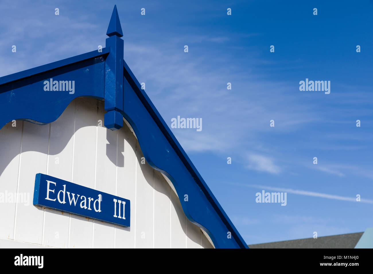 Close up of pitched roof detail and sign on traditional wooden beach ...