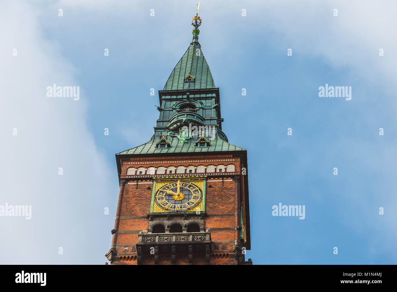 City hall tower spiel and golden clocks in Copenhagen, Denmark Stock ...