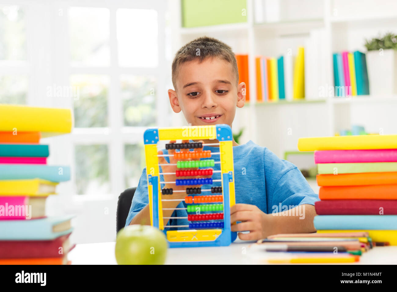 Smiling boy studying math Stock Photo - Alamy