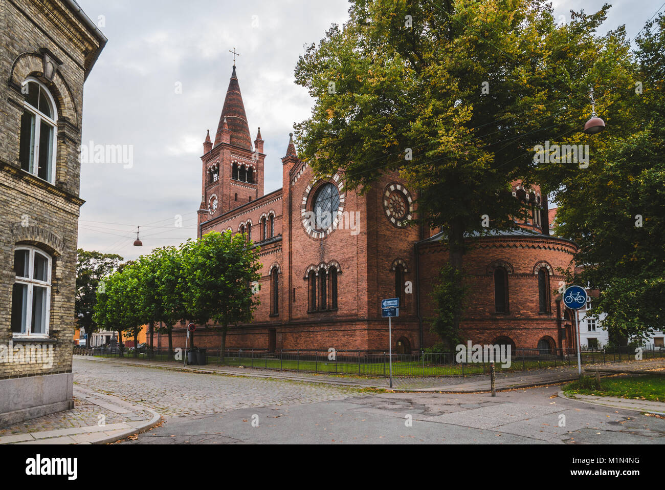 St. Paul's church in Copenhagen, Denmark. Brick catholic church, paved ...
