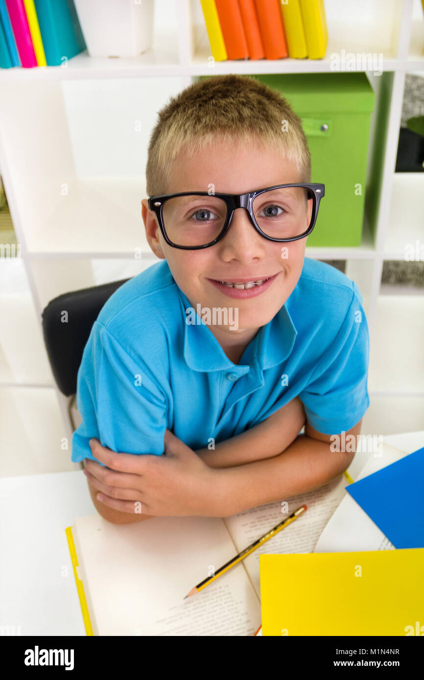 Blonde smiling child studying Stock Photo - Alamy