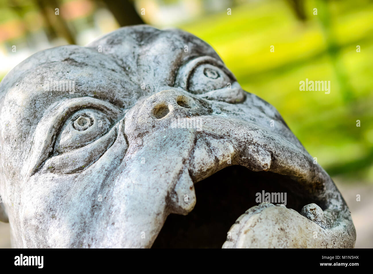 Stone sculpture of figure of dog-monster in Park of Branicki Palace and ...