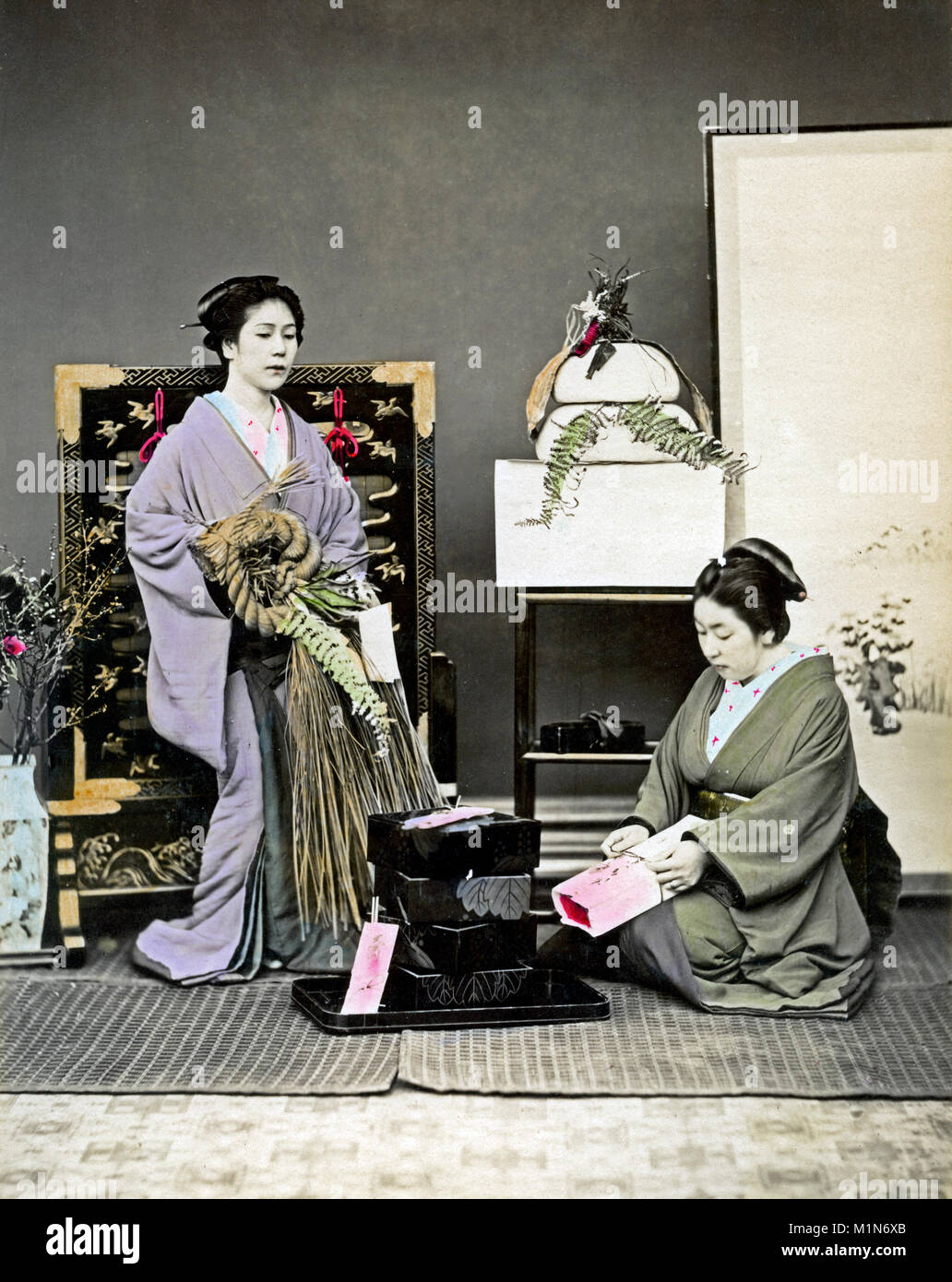 c.1880's Japan - geishas with a gift Stock Photo - Alamy