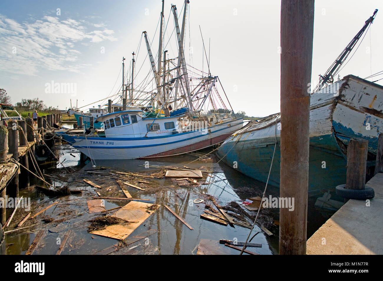A number of shrimp trawlers crashed into the docks by the waves and ...