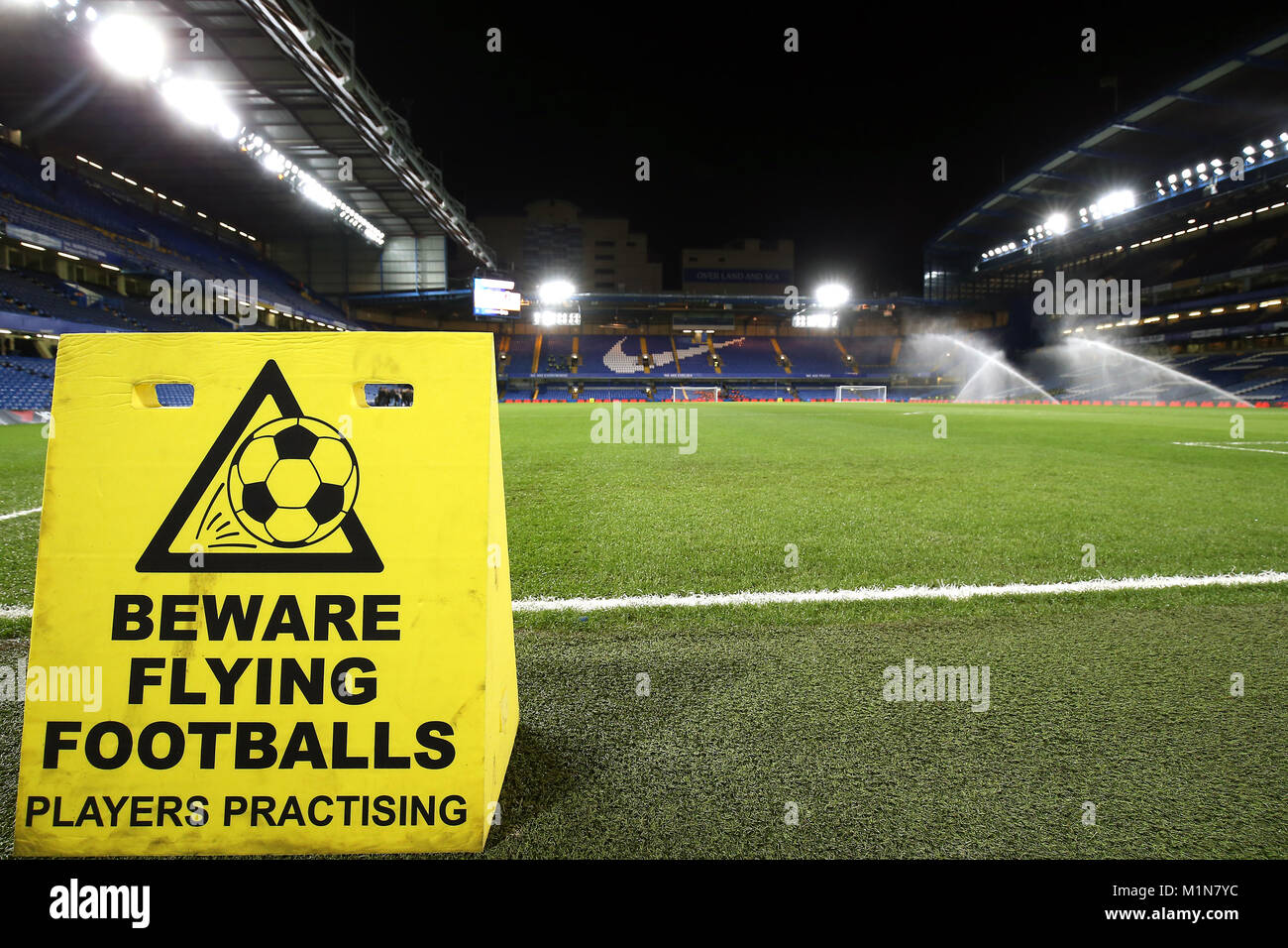 Beware of Flying Footballs sign pitch side prior to the Premier League ...