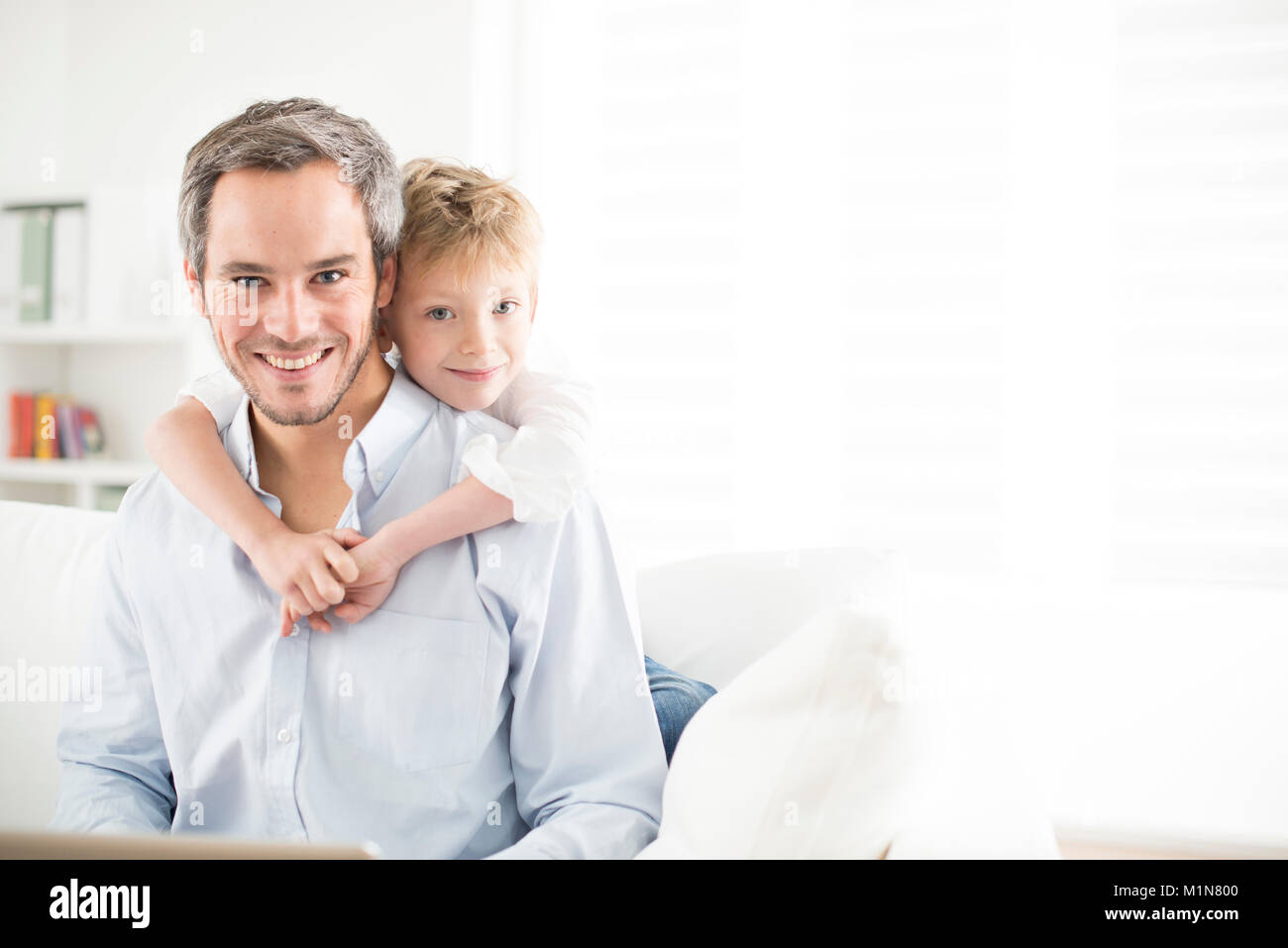 Father and his young son smiling Stock Photo - Alamy