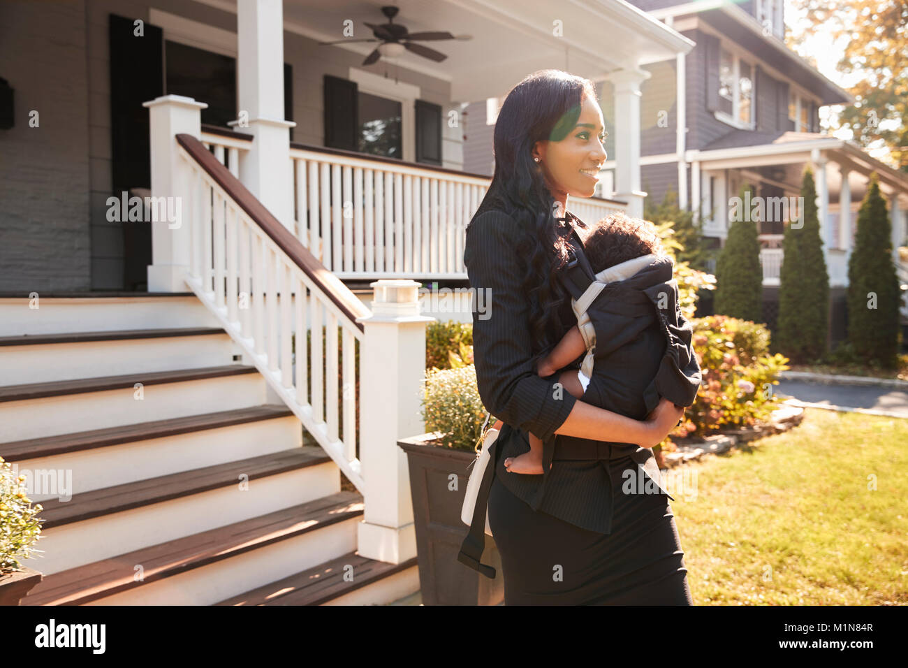 Businesswoman With Baby Son Leaving House For Work Stock Photo - Alamy
