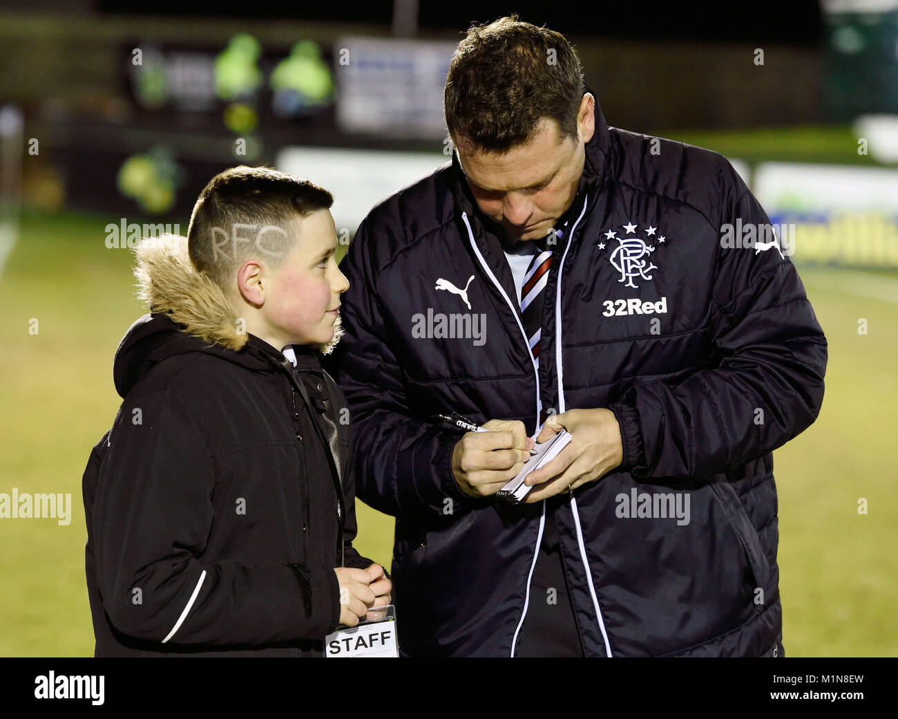 Rangers manager Graeme Murty signs an autograph for a young fan before ...