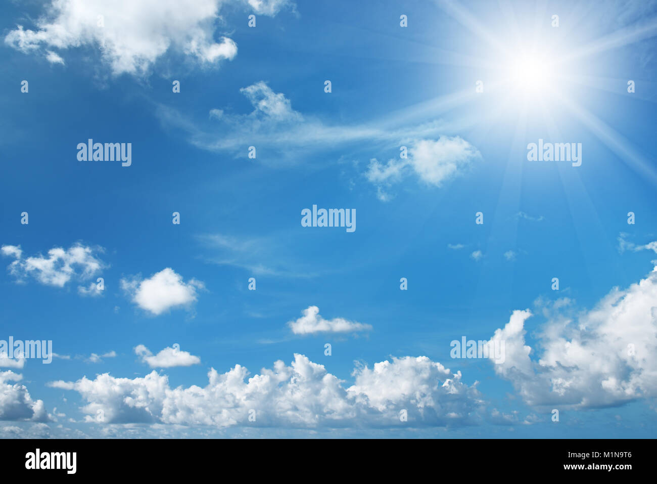 sun on beautiful blue sky Stock Photo - Alamy
