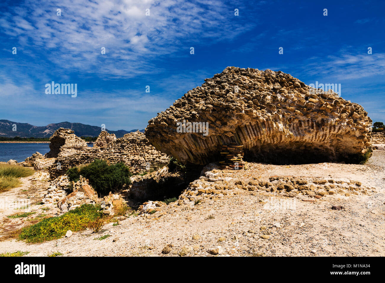 Ancient stone ruins of Nora in Sardegna, Italy. Brick, stone and sand ...