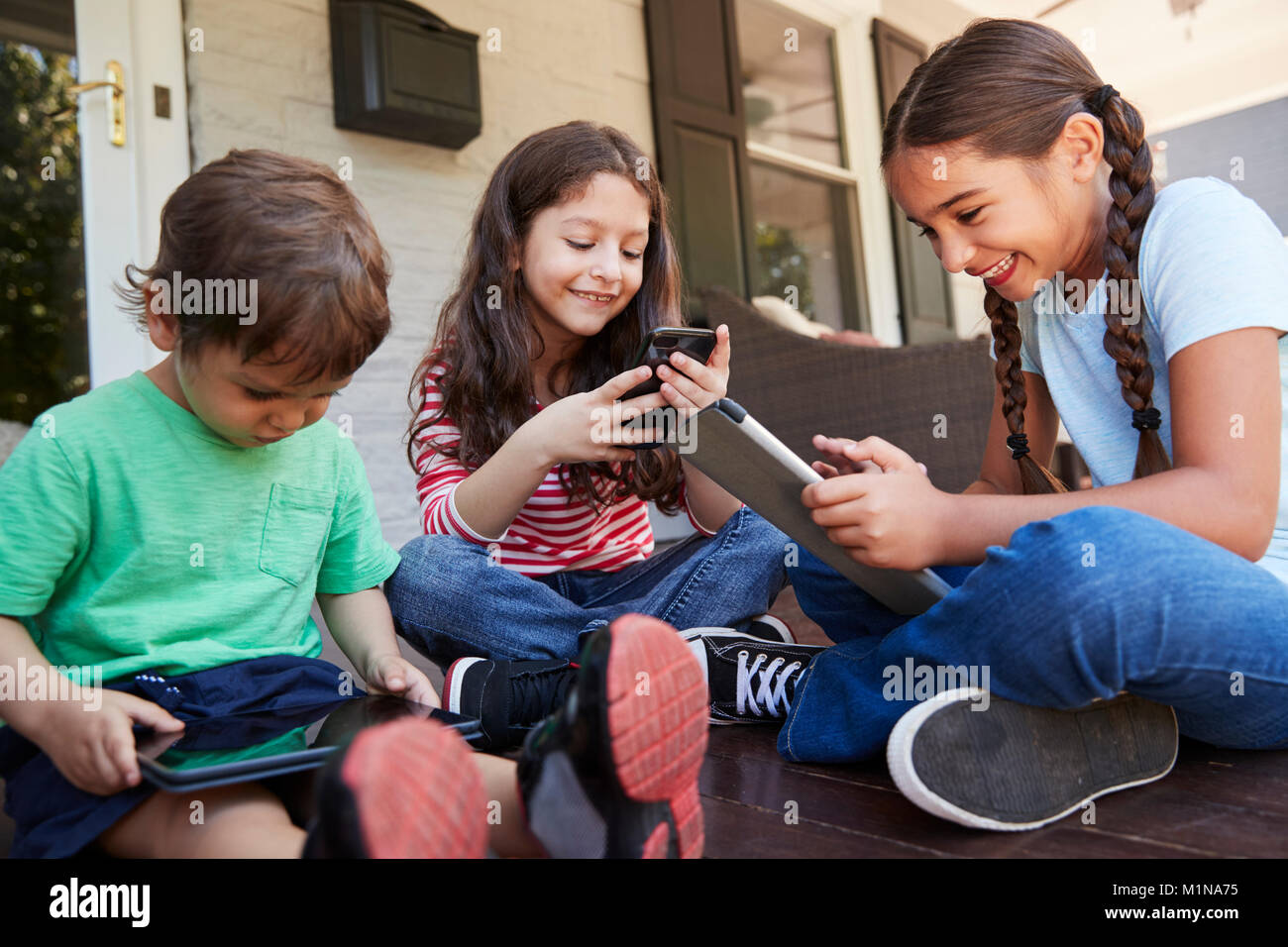 Children in front of front porch hi-res stock photography and images ...