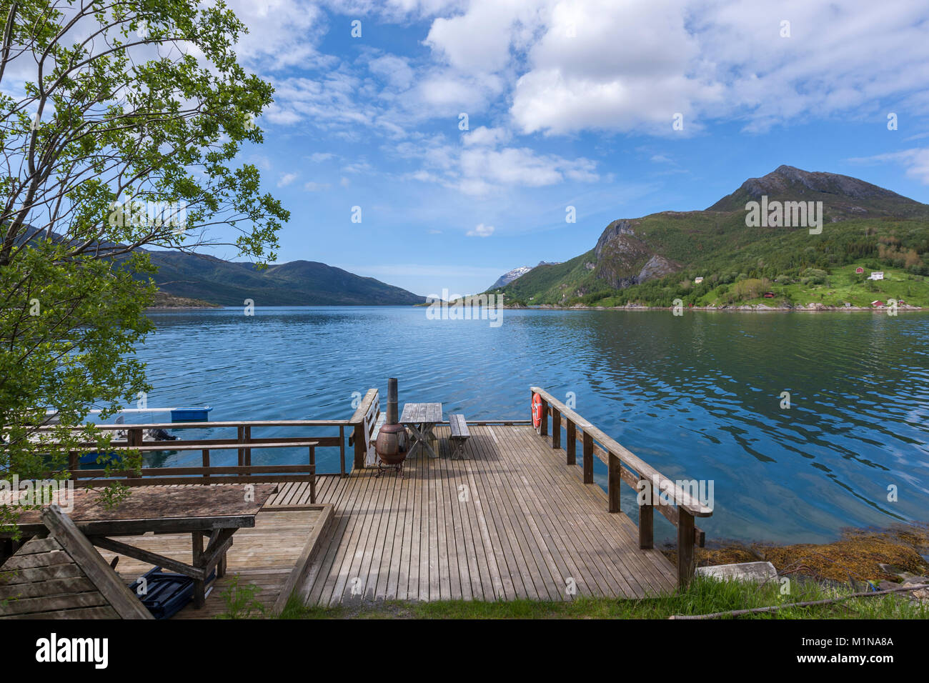 Picnic table in a pier with barbecue along Norwegian County Road 17 ...