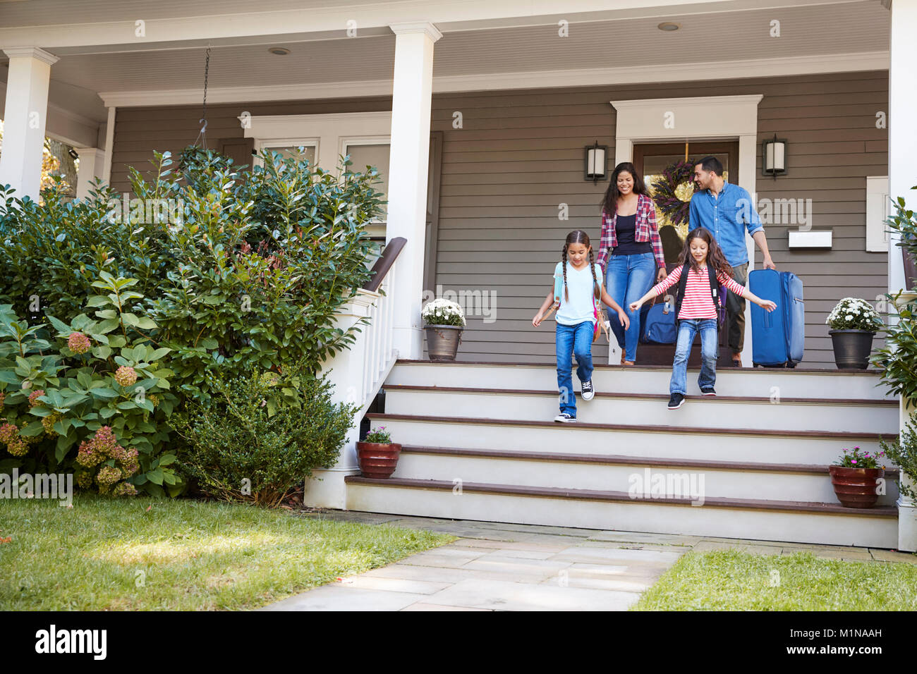 Family Leaving The House