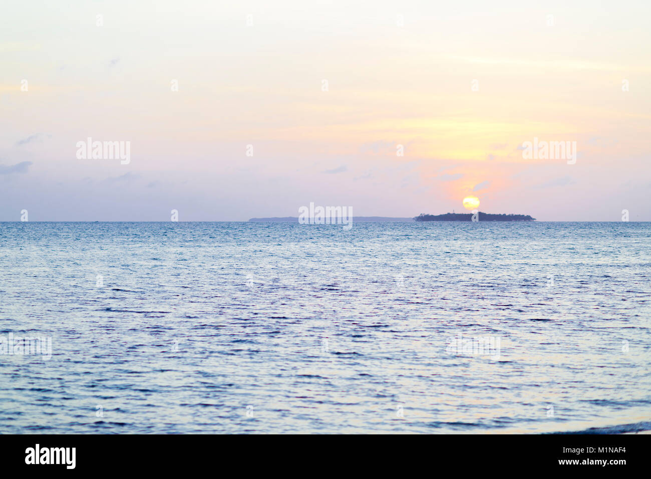 Sunset over the island with beautiful sky Stock Photo - Alamy