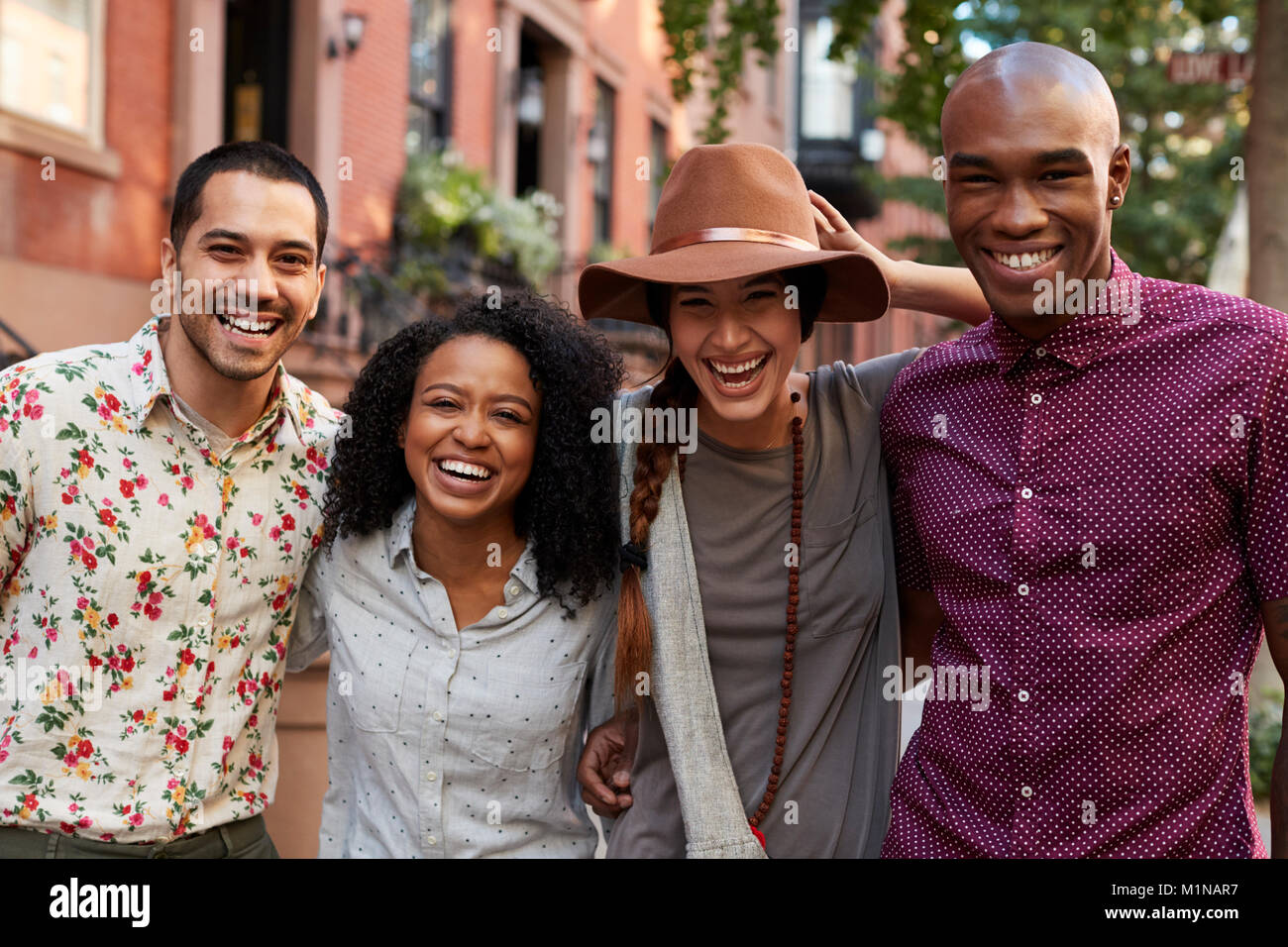 Portrait Of Friends Walking Along Urban Street In New York City Stock ...