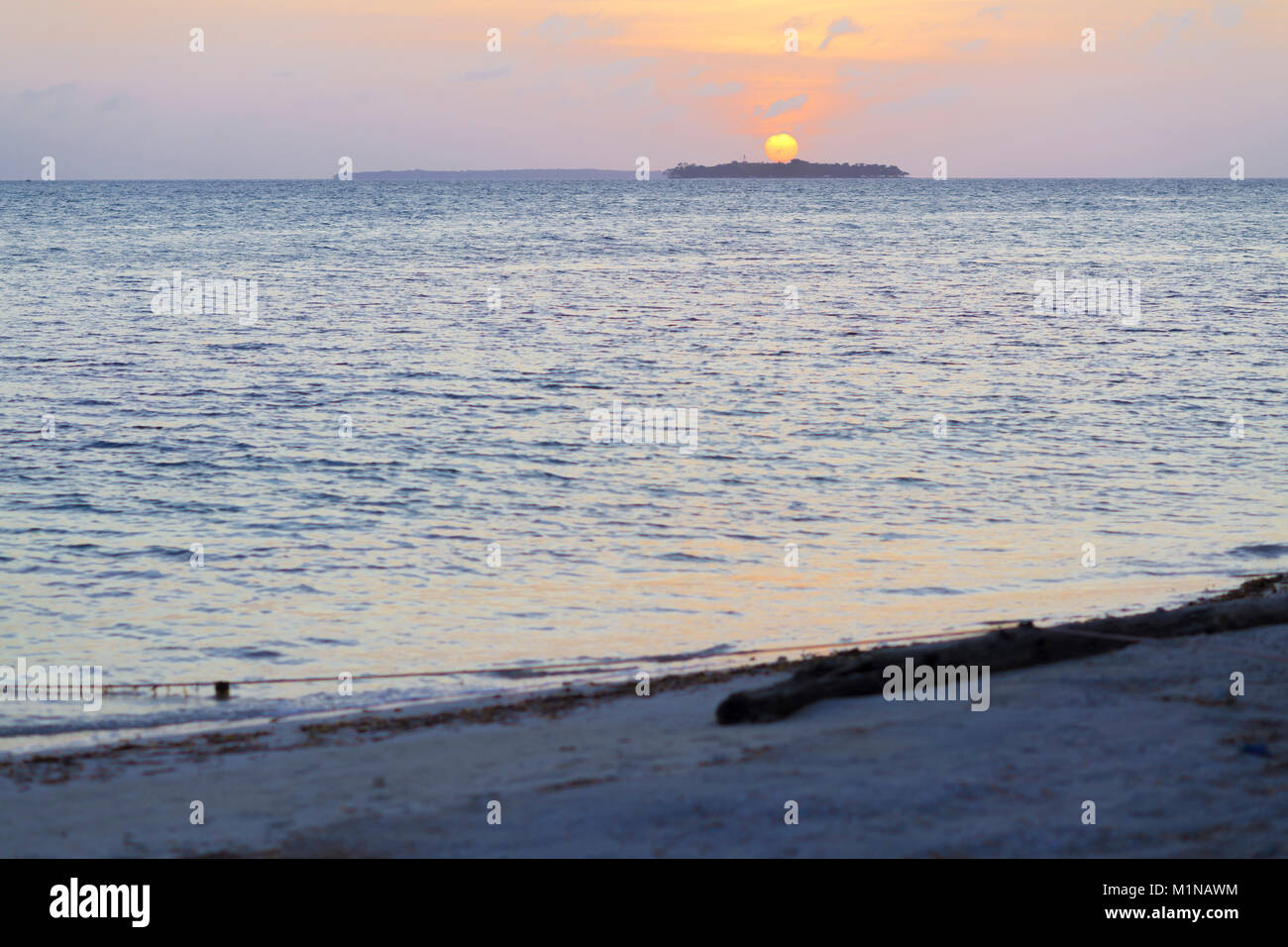 Sunset over the island with beautiful sky Stock Photo - Alamy