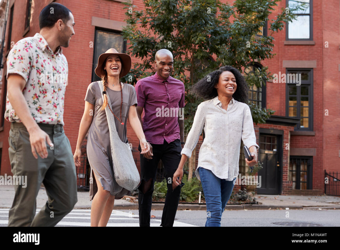 Group Of Friends Crossing Urban Street In New York City Stock Photo - Alamy