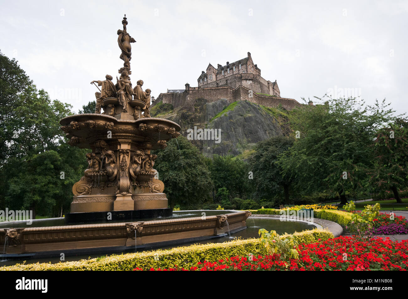 View of Edinburgh castle from princess gardens with the famous fountain ...