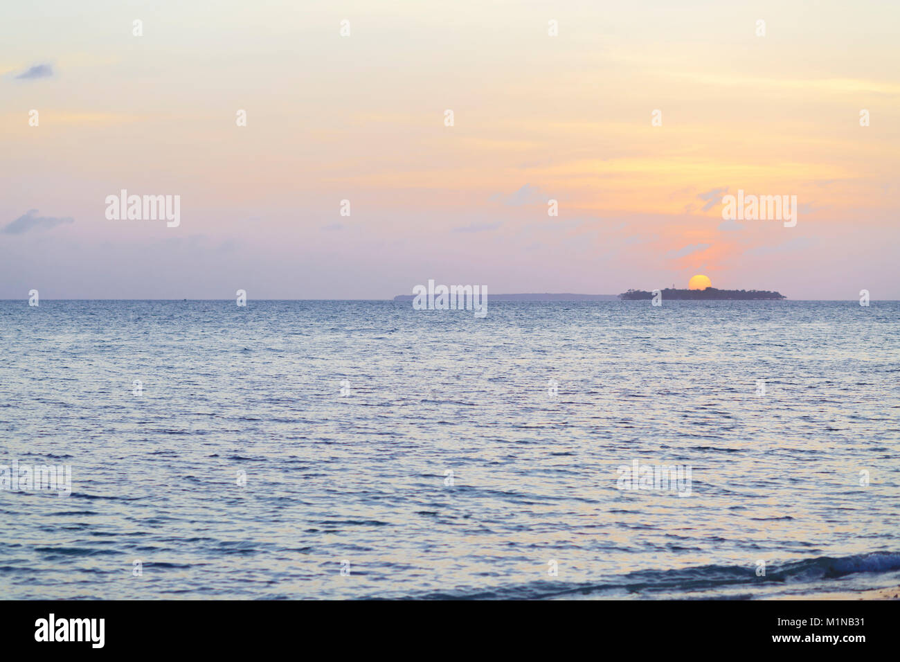 Sunset over the island with beautiful sky Stock Photo - Alamy