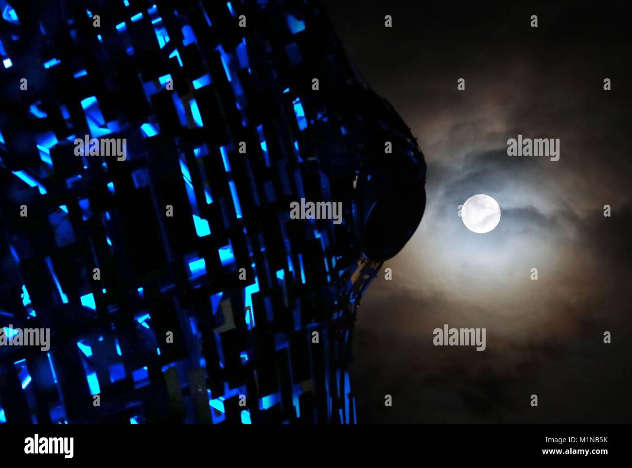 A blue moon rises over the Kelpies in Central Scotland Stock Photo - Alamy