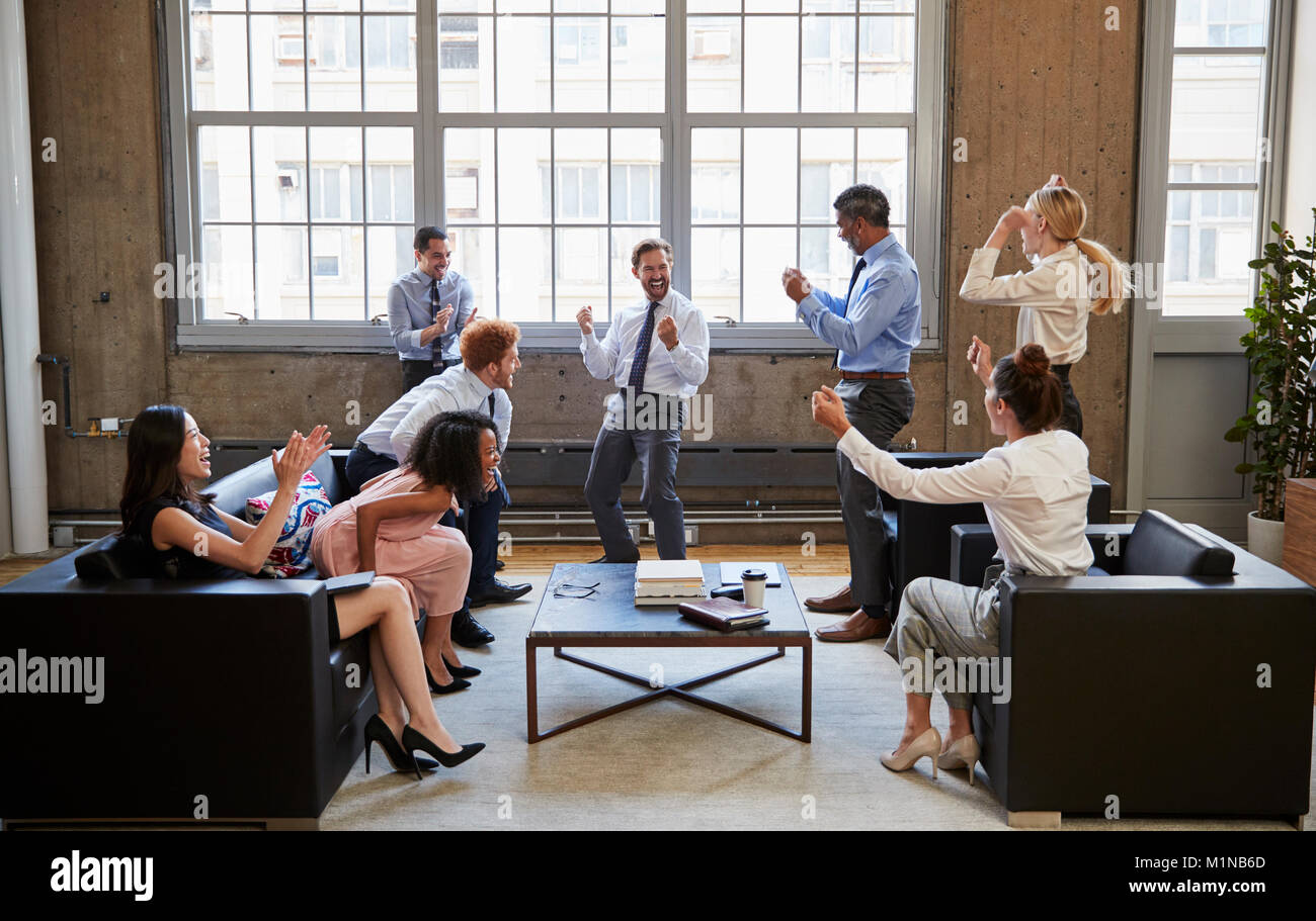 Business team celebrate hitting target at informal meeting Stock Photo ...