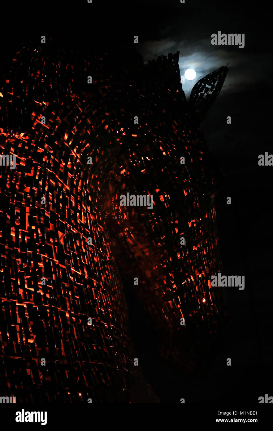 A blue moon rises over the Kelpies in Central Scotland Stock Photo - Alamy